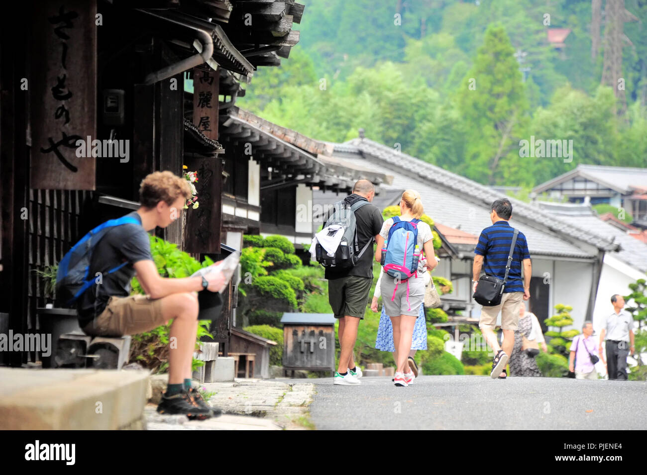 Caucasian tourists in Tsumago, an old townscape preserved area in Japan ...