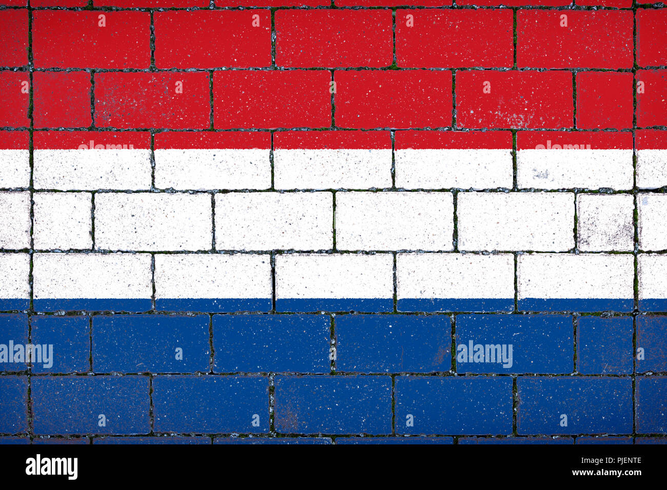 National flag of Netherlands against a background of a stone background ...