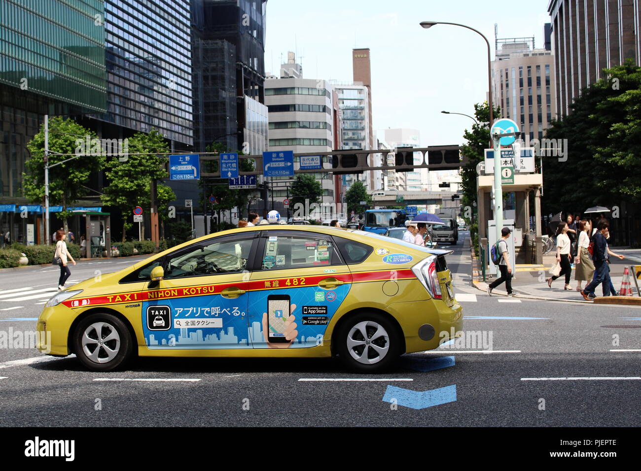 A Toyota Prius hybrid taxi cab (operated by Nihon Katsu) waits at at a ...
