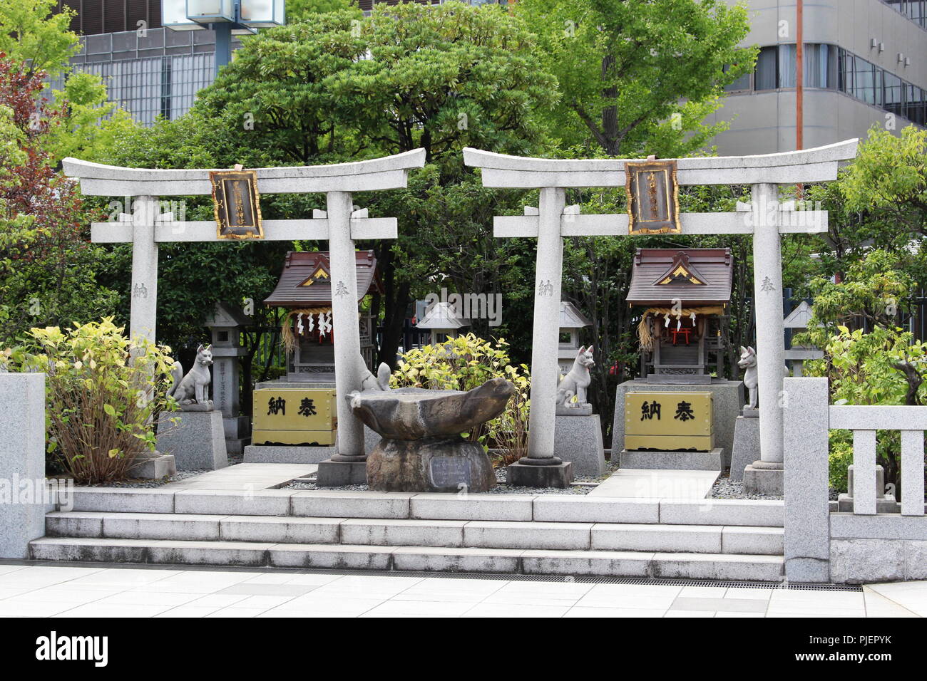 A pair of small Shinto shrines at Ryogoku's Kokugikan sumo venue. Pairs ...