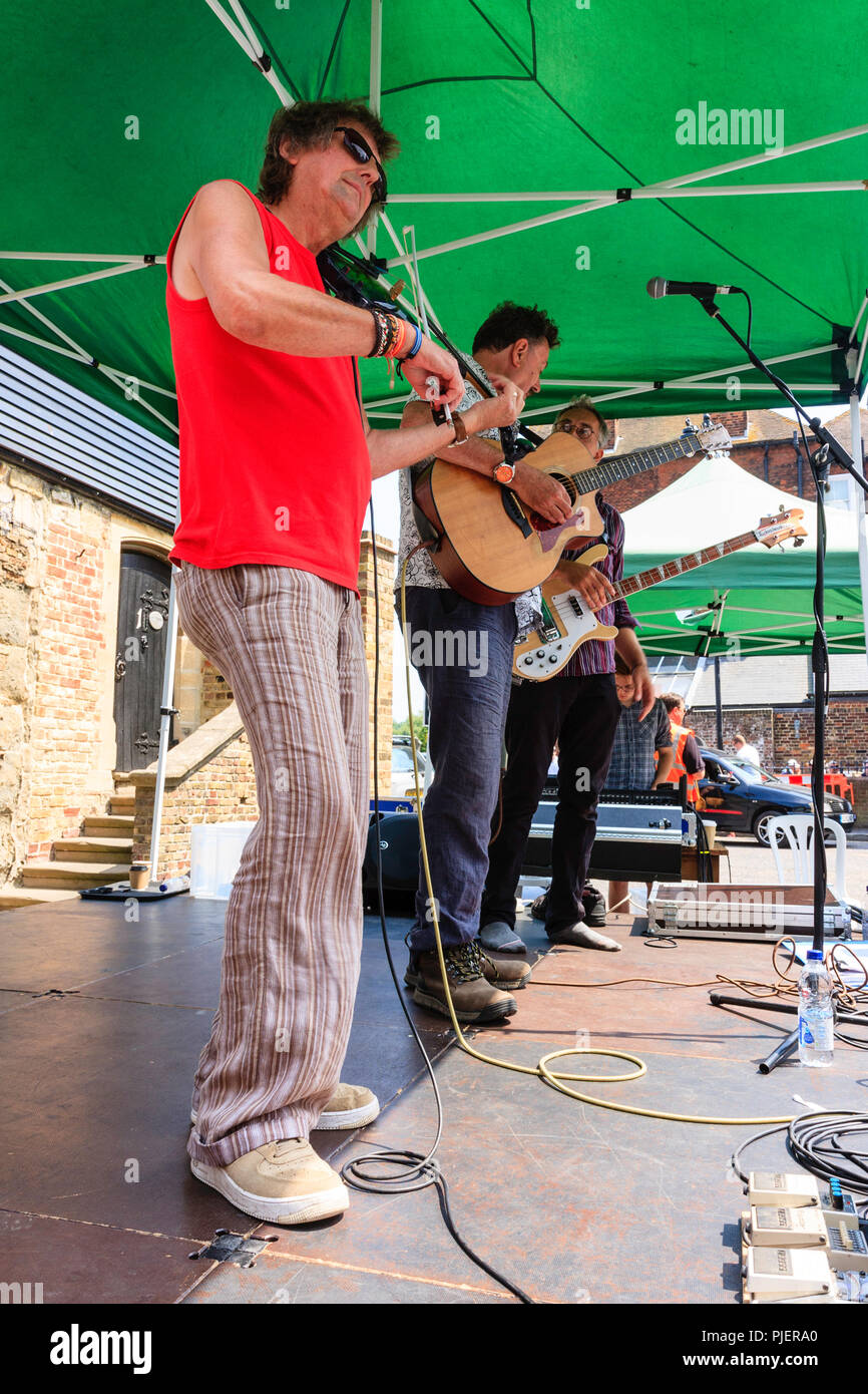 The Hot Rats performing on a small open stage during the Sandwich Folk ...