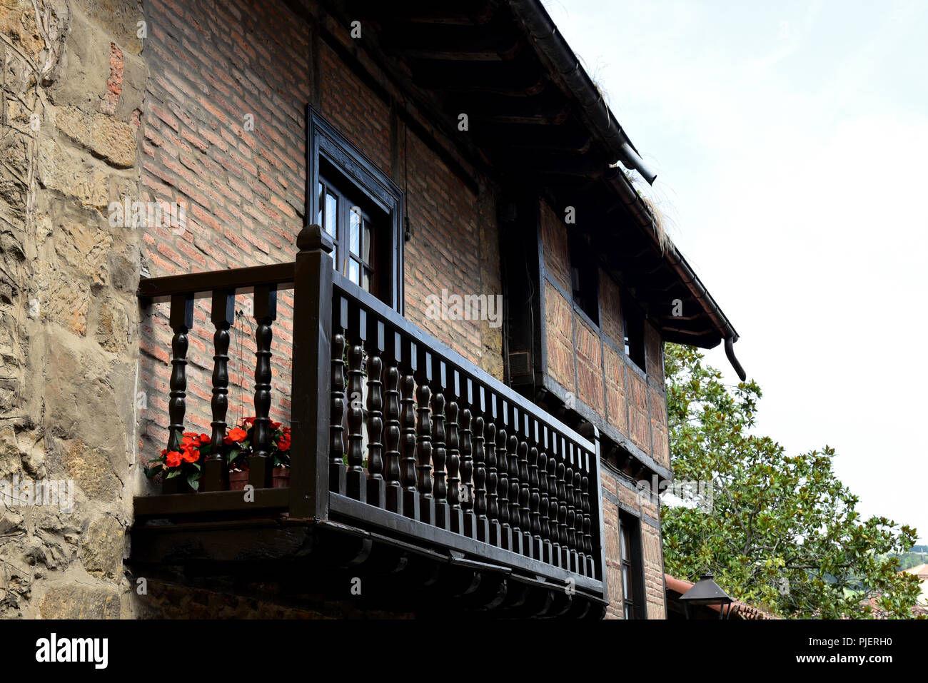 artistic balconies in the old village Stock Photo - Alamy