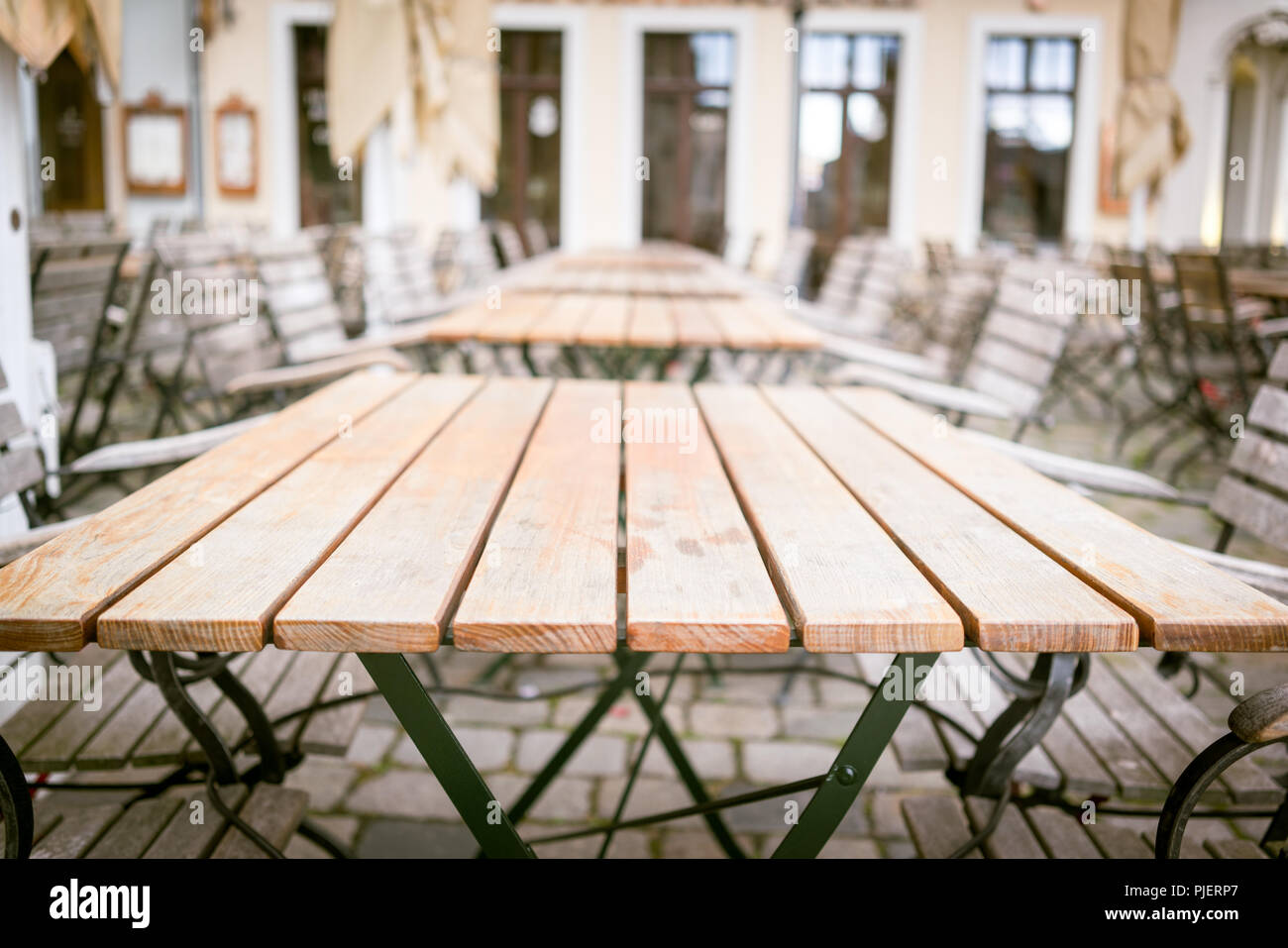 Table of a street cafe in a European city. Toned photo Stock Photo - Alamy