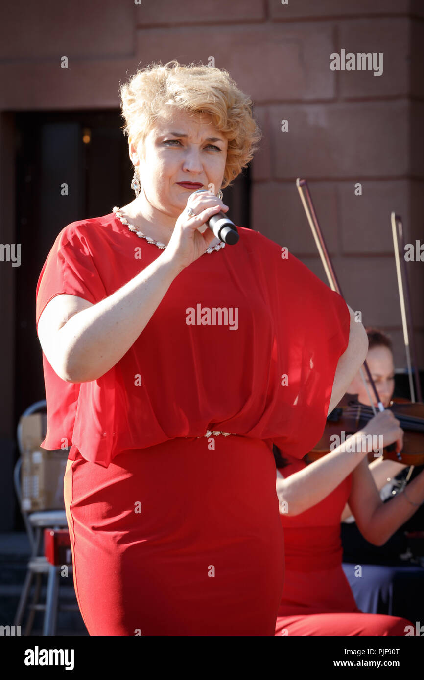 Opera singer at gala concert. Vitebsk symphonic orchestra at open-air ...