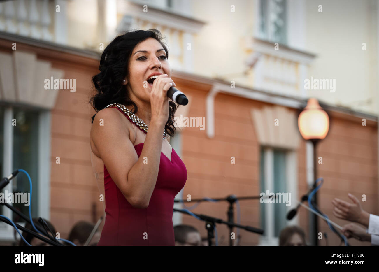 Jazz singer at gala concert. Vitebsk symphonic orchestra at open-air ...