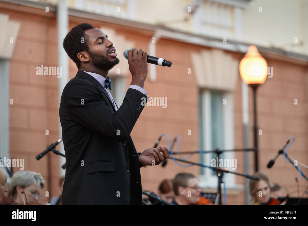 Jazz singer at gala concert. Vitebsk symphonic orchestra at open-air ...