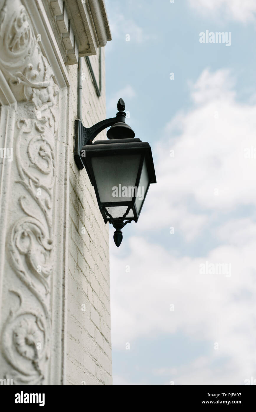 Old street lamp on an ornate building facade Stock Photo - Alamy