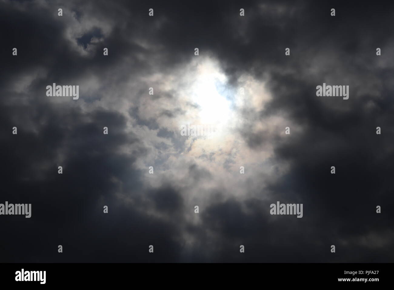 Eerie sky with a light in the middle Stock Photo - Alamy