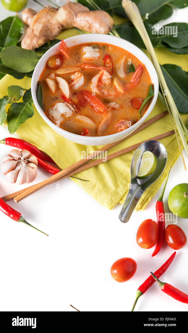 Tom Yum Goong or spicy tom yum soup with prawns shrimps - Authentic Thai style food. With ...