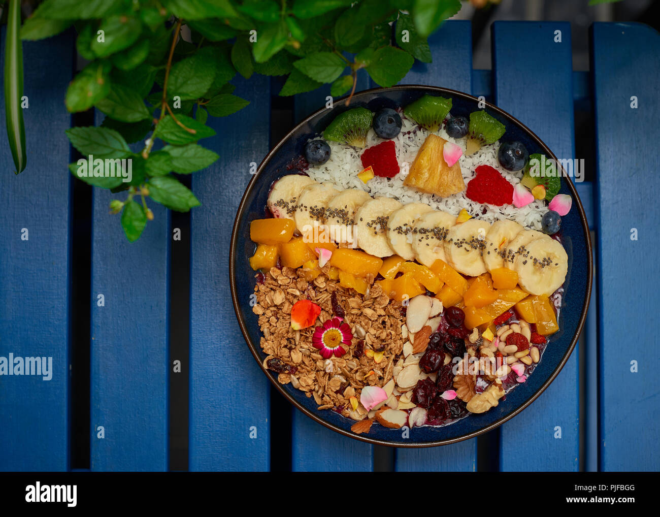 Colorful Acai bowl on the blue background Stock Photo - Alamy