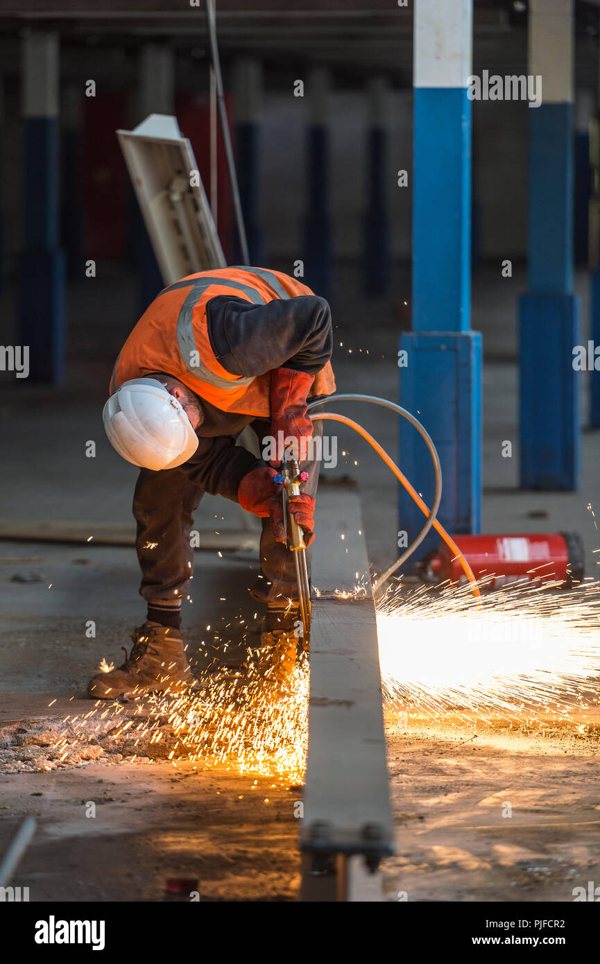 Building site worker cutting a beam with an acetylene torch Stock Photo ...