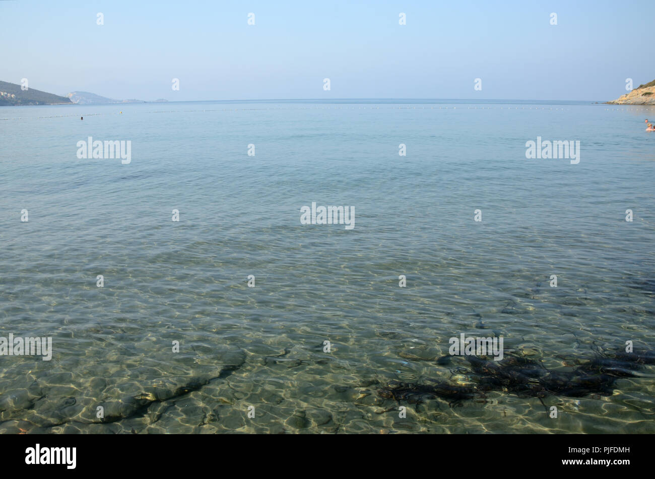 Aegean Sea in Kusadasi, Turkey, summer holiday. Clean water and horizon ...