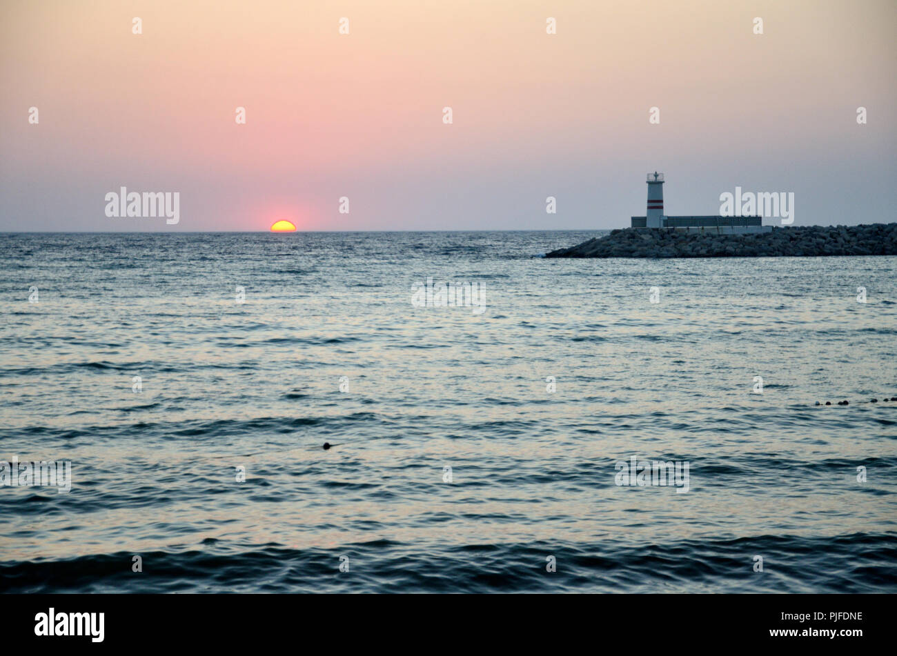 Sunset in Kusadasi, Turkey. Calm Aegean Sea in the evening Stock Photo ...