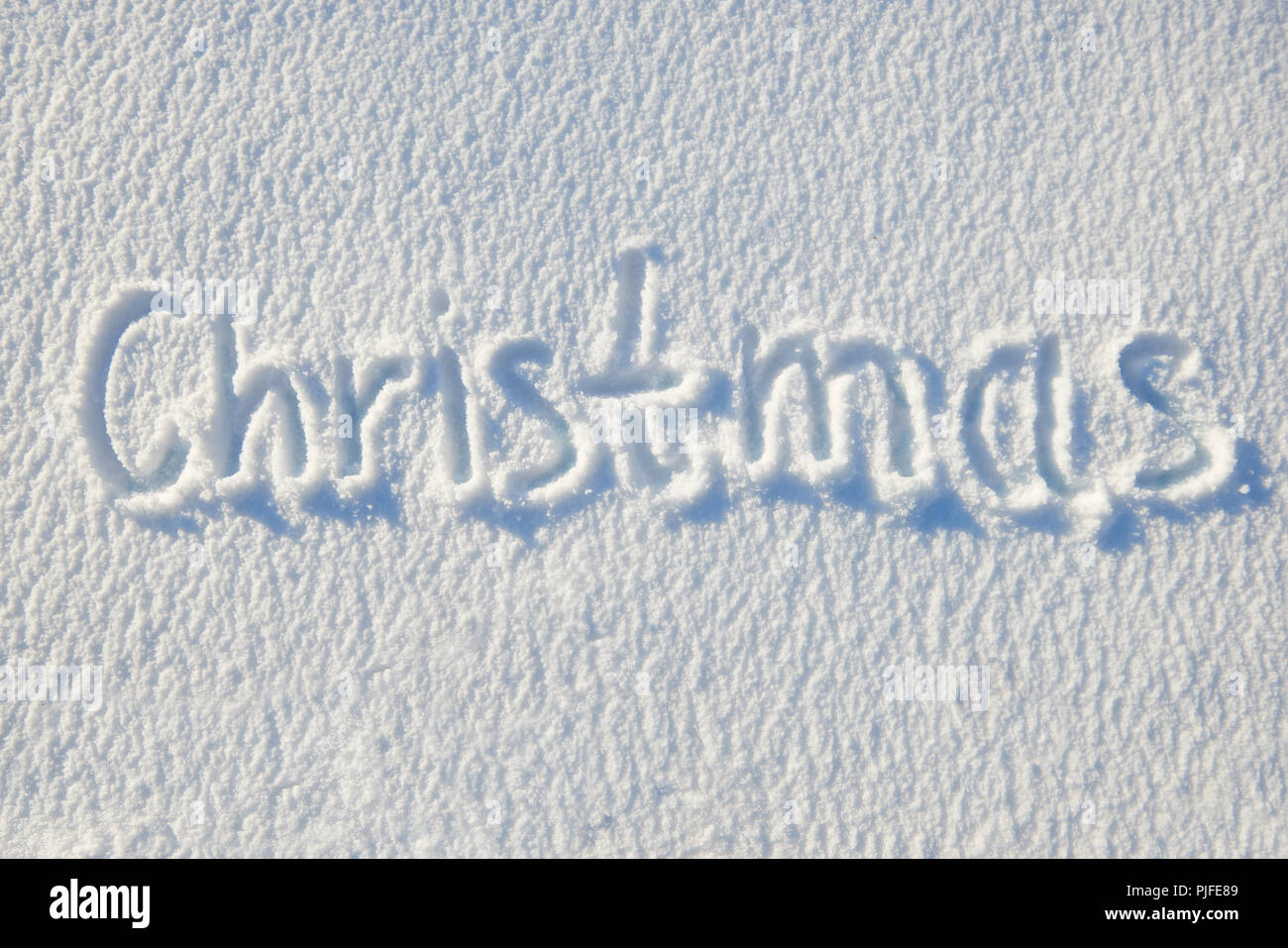 Christmas text written on snow for texture or background - winter ...