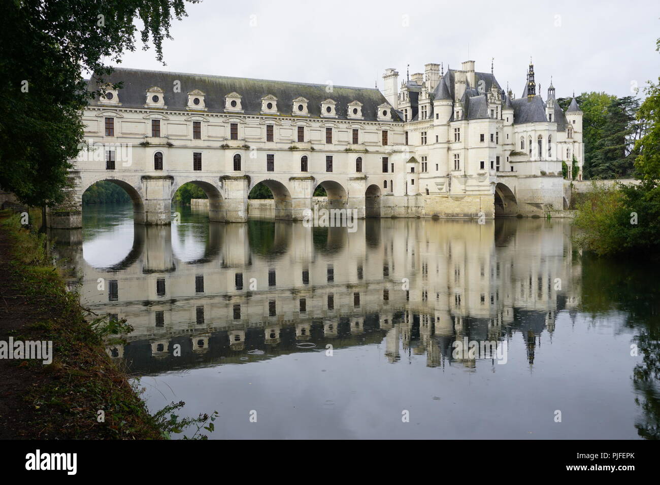 Mirror reflection of a beautiful Loire castle in the river on a spring ...