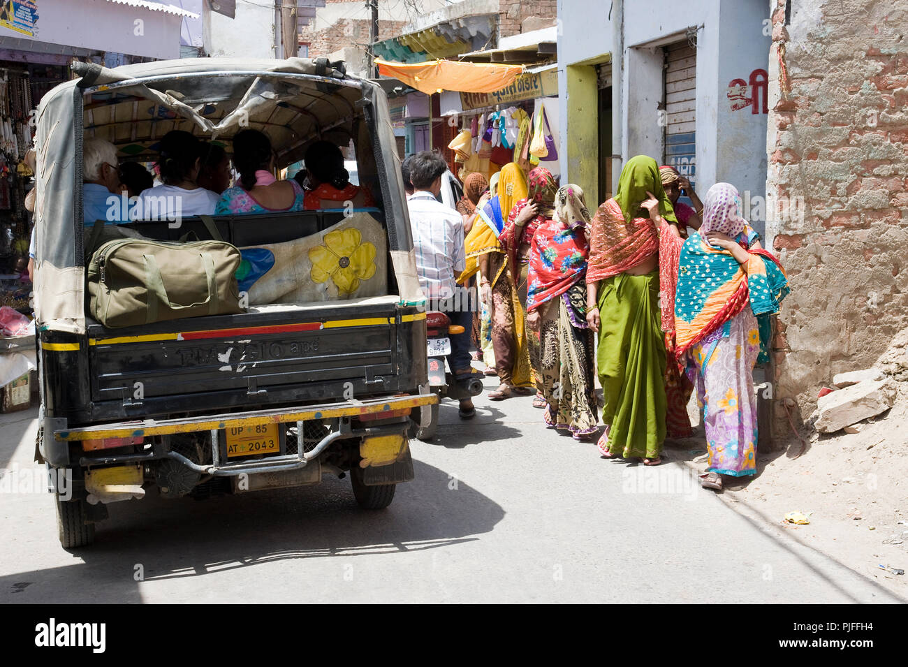 Traditional indian woman performing hindu rituals at Radha Kund and ...