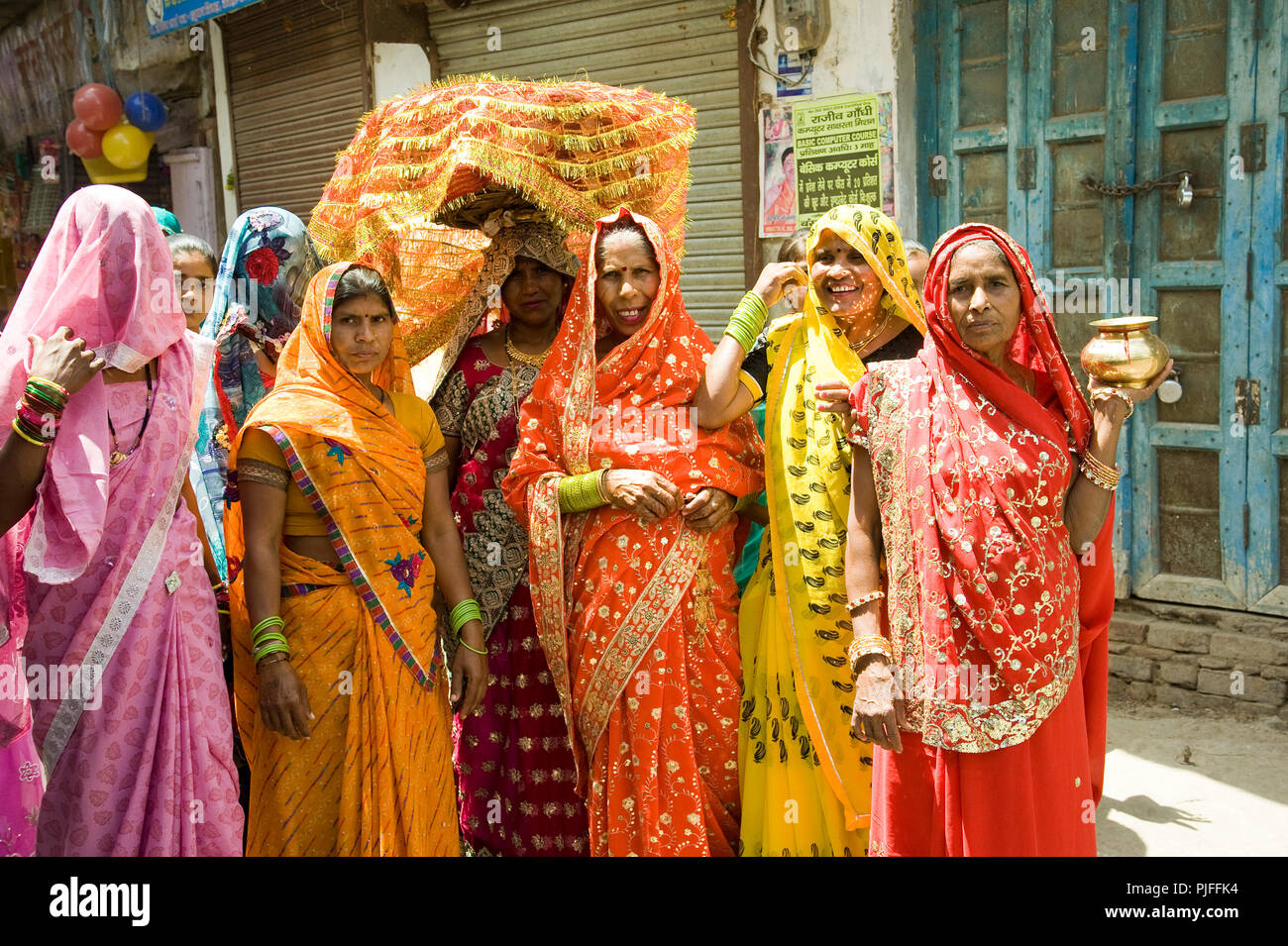 Traditional indian woman performing hindu rituals at Radha Kund and ...