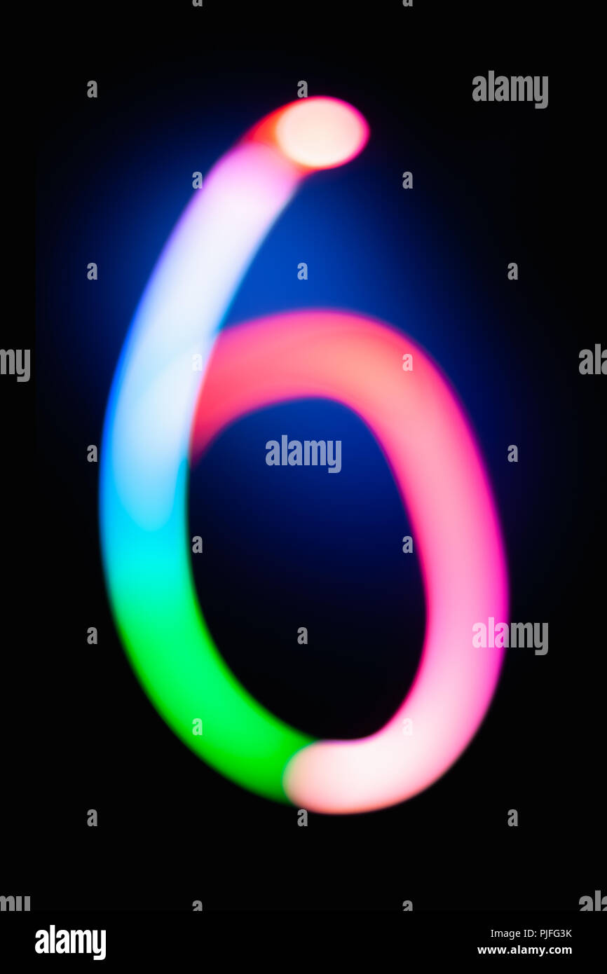 Digit 6. Six. Glowing numbers on dark background. Abstract light painting at night. Creative ...