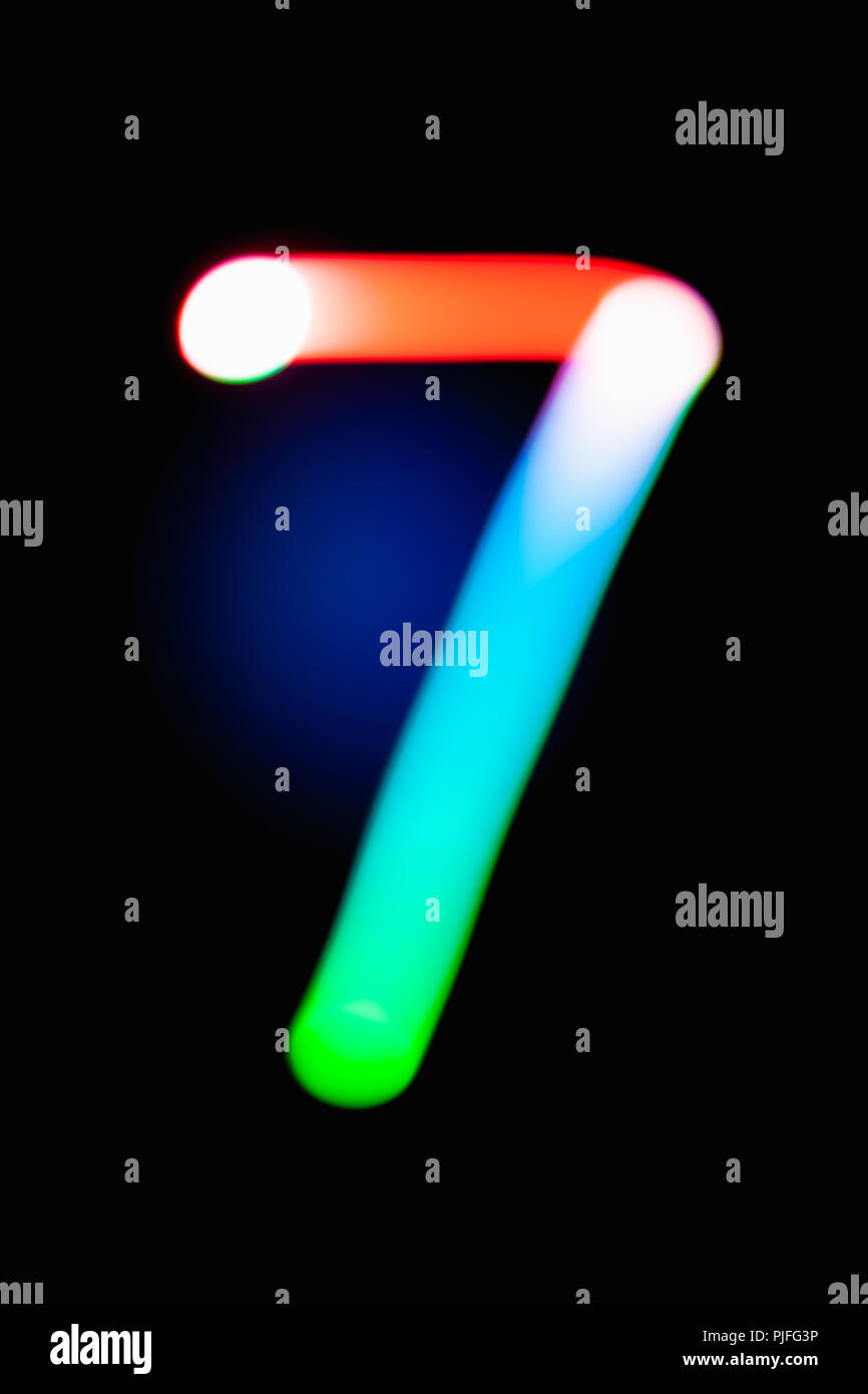 Digit 7. Seven. Glowing numbers on dark background. Abstract light ...