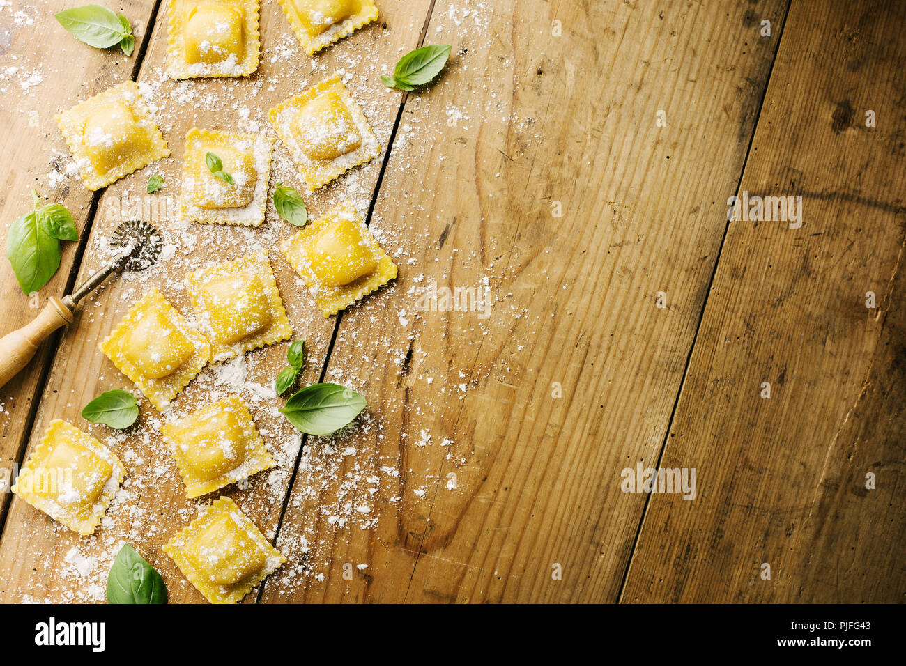 Process of cooking italian ravioli on wooden table. Cooking process ...