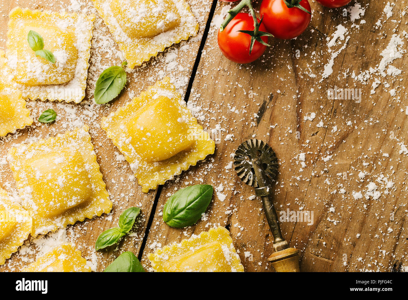 Process of cooking italian ravioli on wooden table. Cooking process ...
