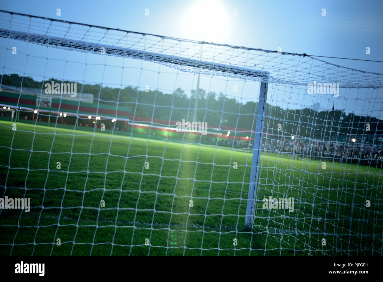 photograph is taken from behind the empty soccer goal Stock Photo - Alamy