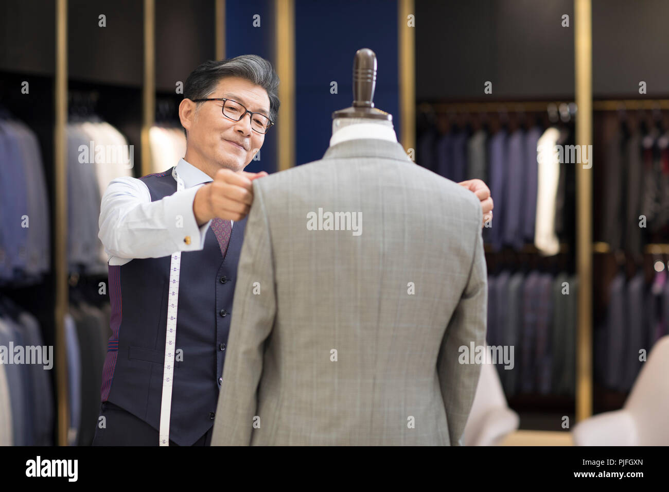 Confident fashion designer working Stock Photo - Alamy