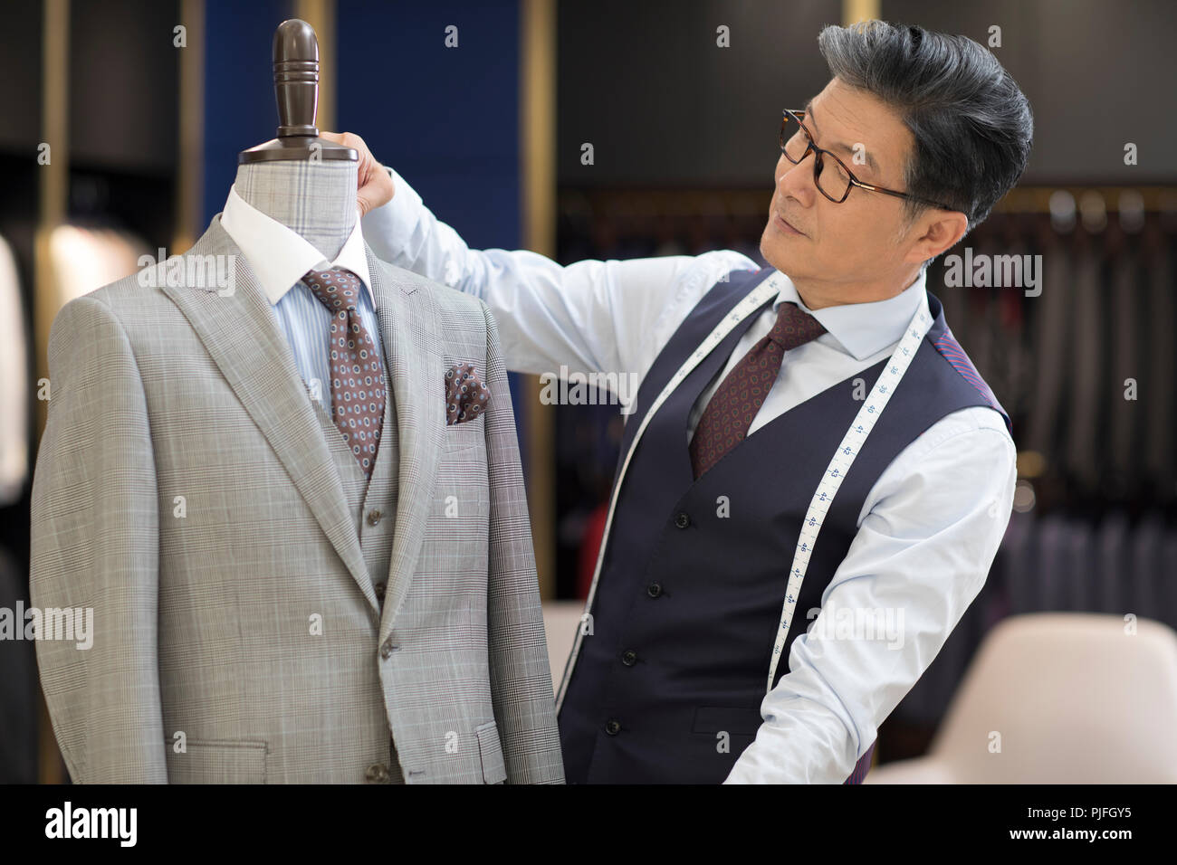 Confident fashion designer working Stock Photo - Alamy