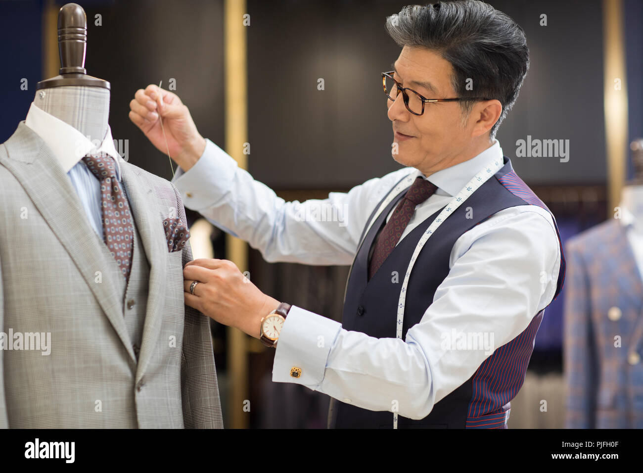Confident fashion designer working Stock Photo - Alamy