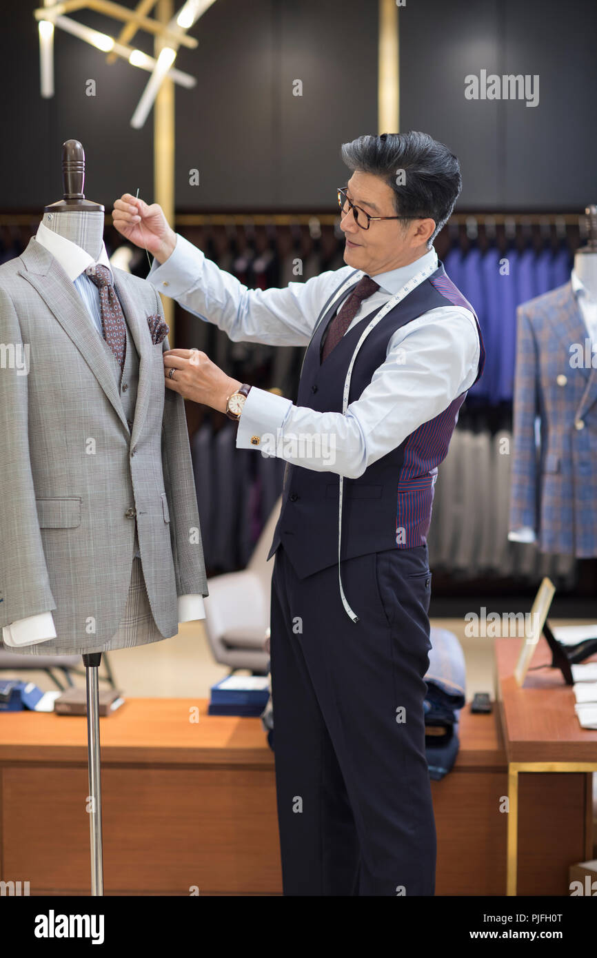 Confident fashion designer working Stock Photo - Alamy