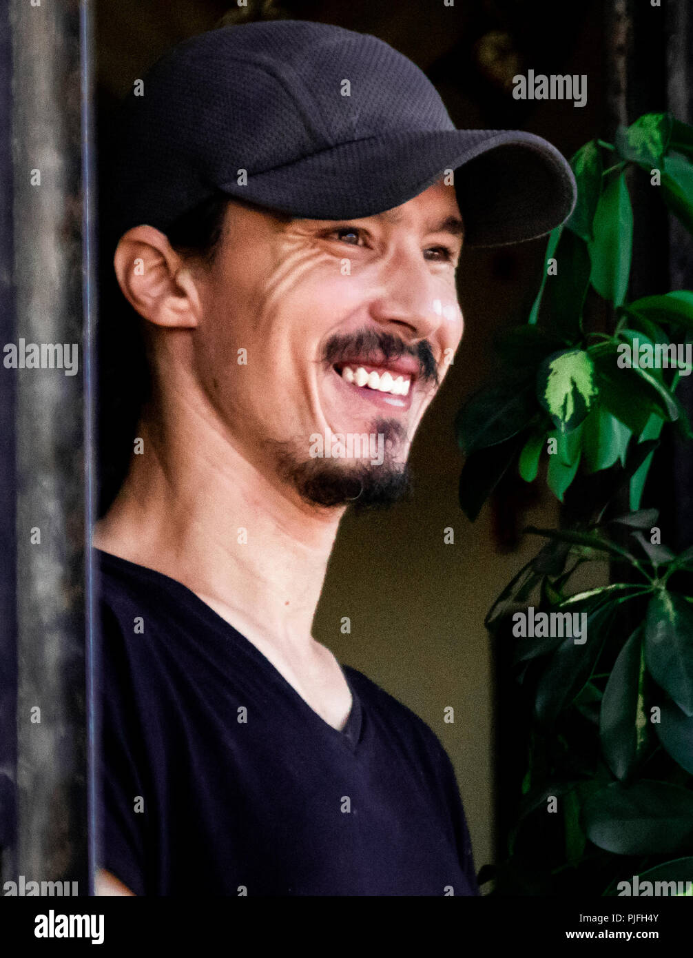 male head shot men man moroccan rasta hat hair Stock Photo - Alamy