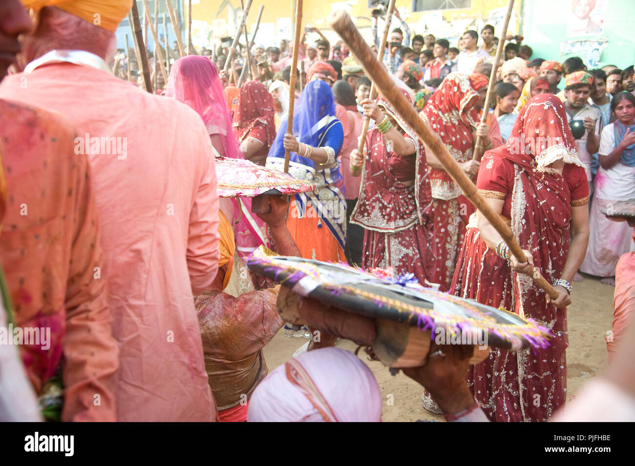 women and men Devotees they clelebrate Lathmar Holi Festival Indian ...