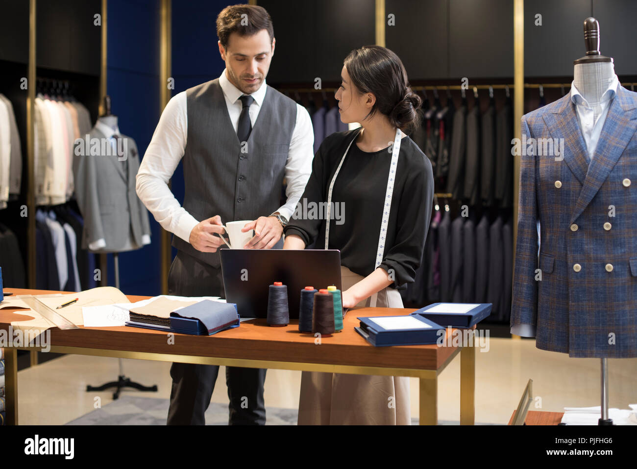 Two clothing designers using hi-res stock photography and images - Alamy