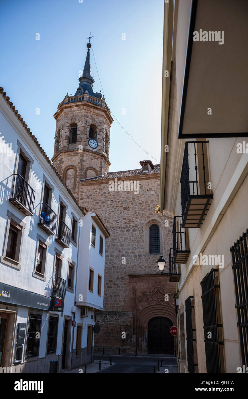 Tembleque, Spain, is a small village with a church and clock tower at ...