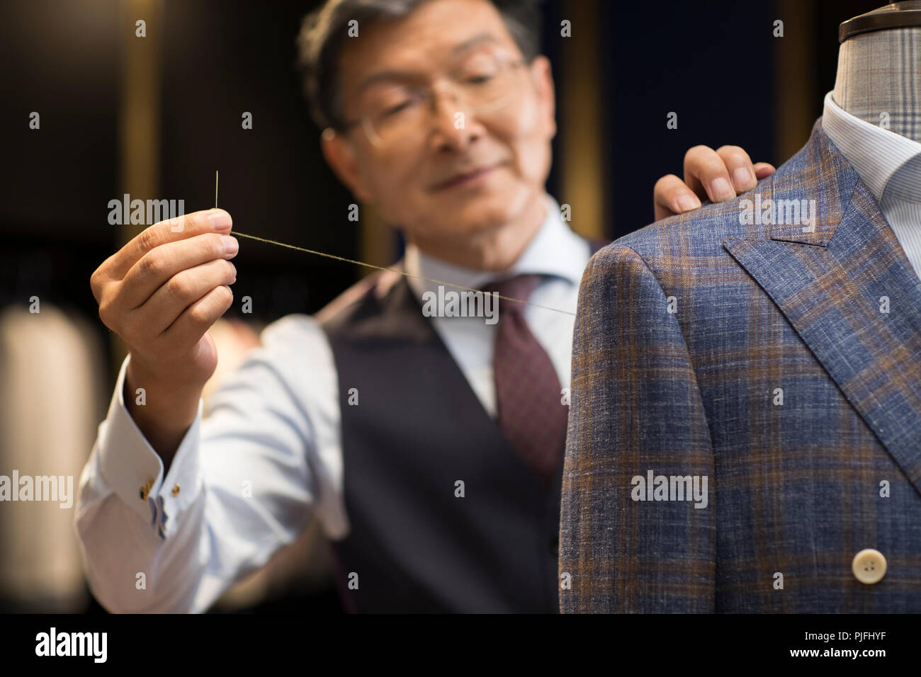 Confident fashion designer working Stock Photo - Alamy