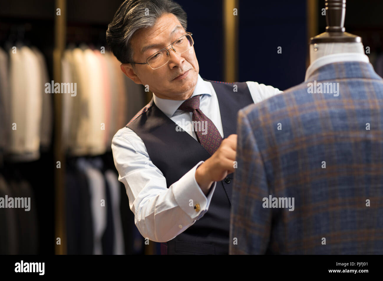 Confident fashion designer working Stock Photo - Alamy