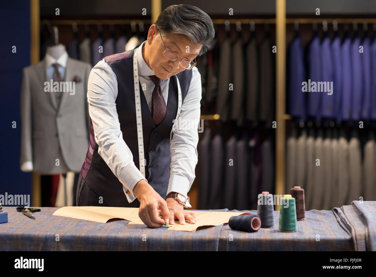 Confident fashion designer working Stock Photo - Alamy