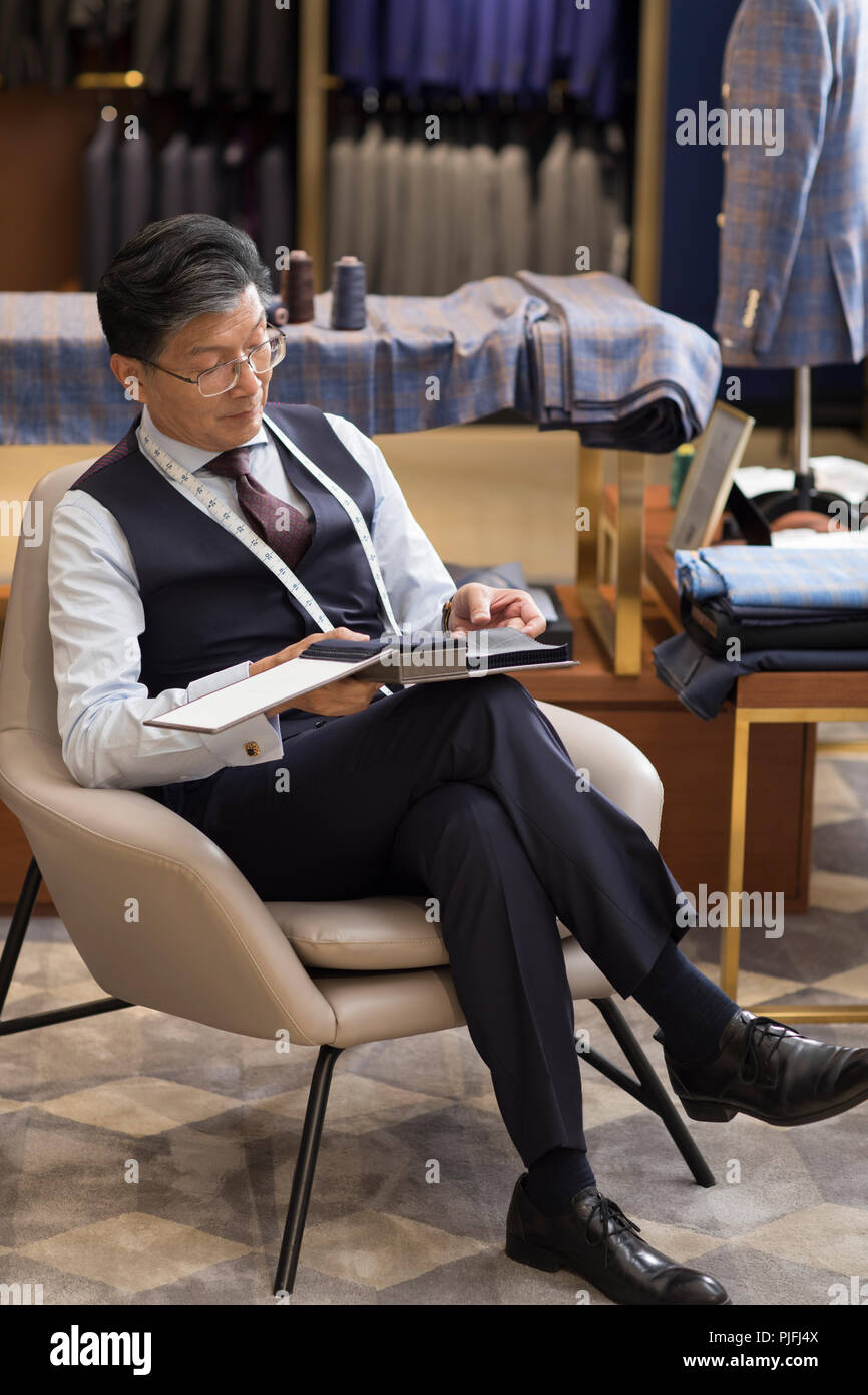 Confident fashion designer working Stock Photo - Alamy