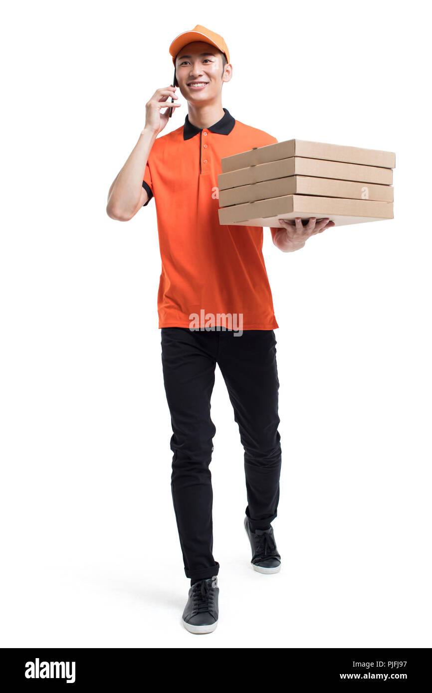 Pizza delivery man holding phone Cut Out Stock Images & Pictures - Alamy