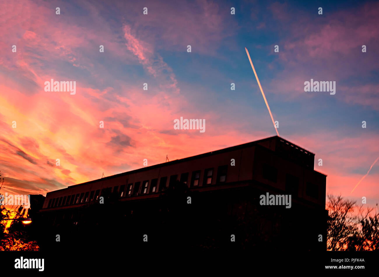 Vivid colored mystic sky, dark silhouette, ray of lights Stock Photo ...