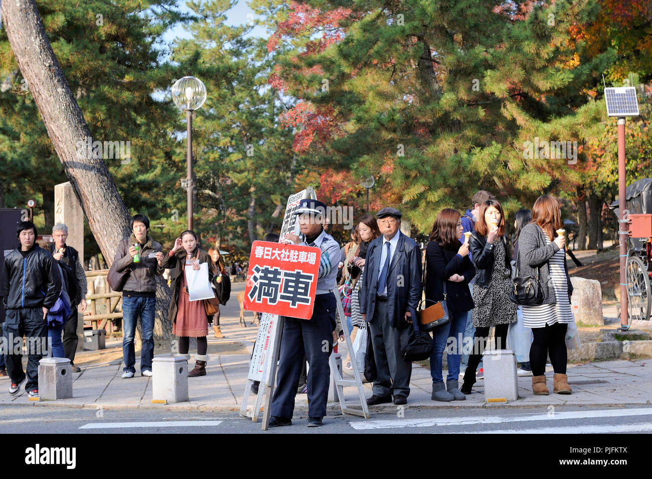 Japan, Honshu island, Nara, traffic cop at a pedestrian crossing Stock ...