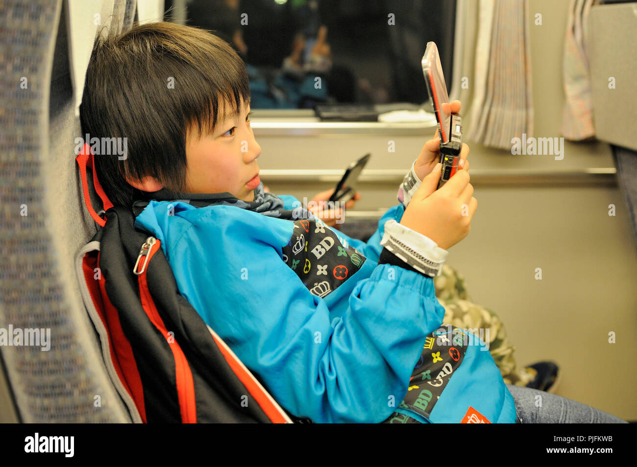 Japan, boy in the high-speed train Shinkansen Stock Photo - Alamy