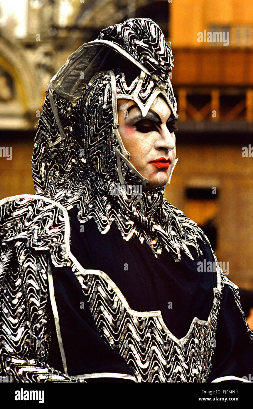 Europe, Italy, Venice Carnival. Person grime wearing a black and white ...