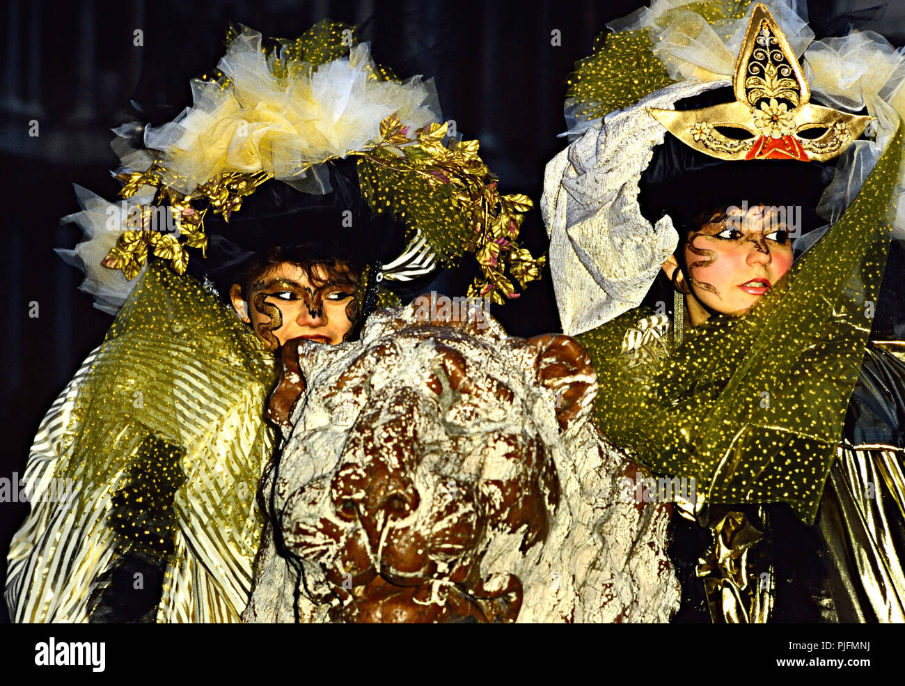 Europe, Italy, Venice Carnival. Two young women grimees flamboyant ...