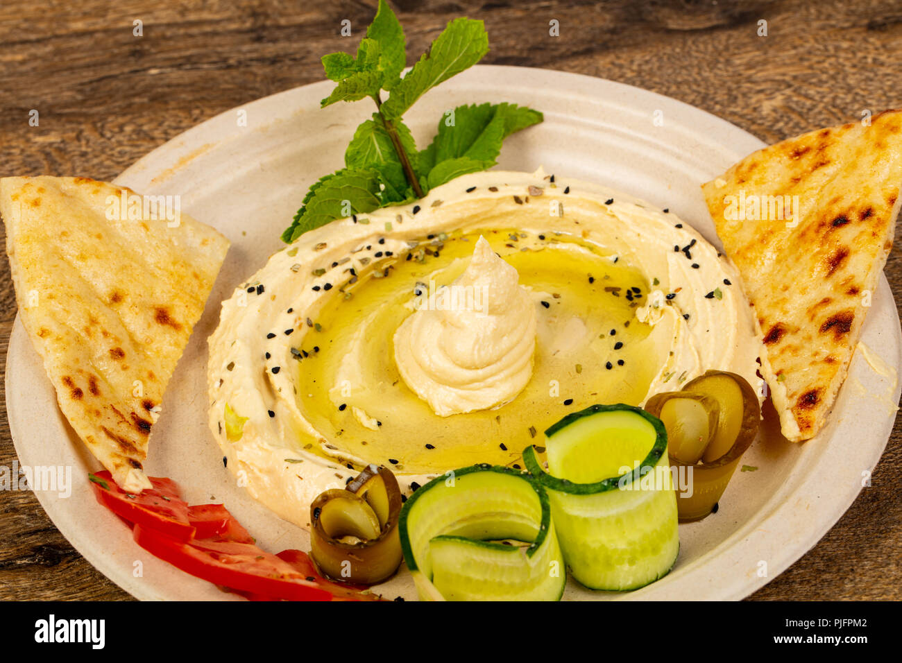 Traditional humus with oil and pita bread Stock Photo - Alamy