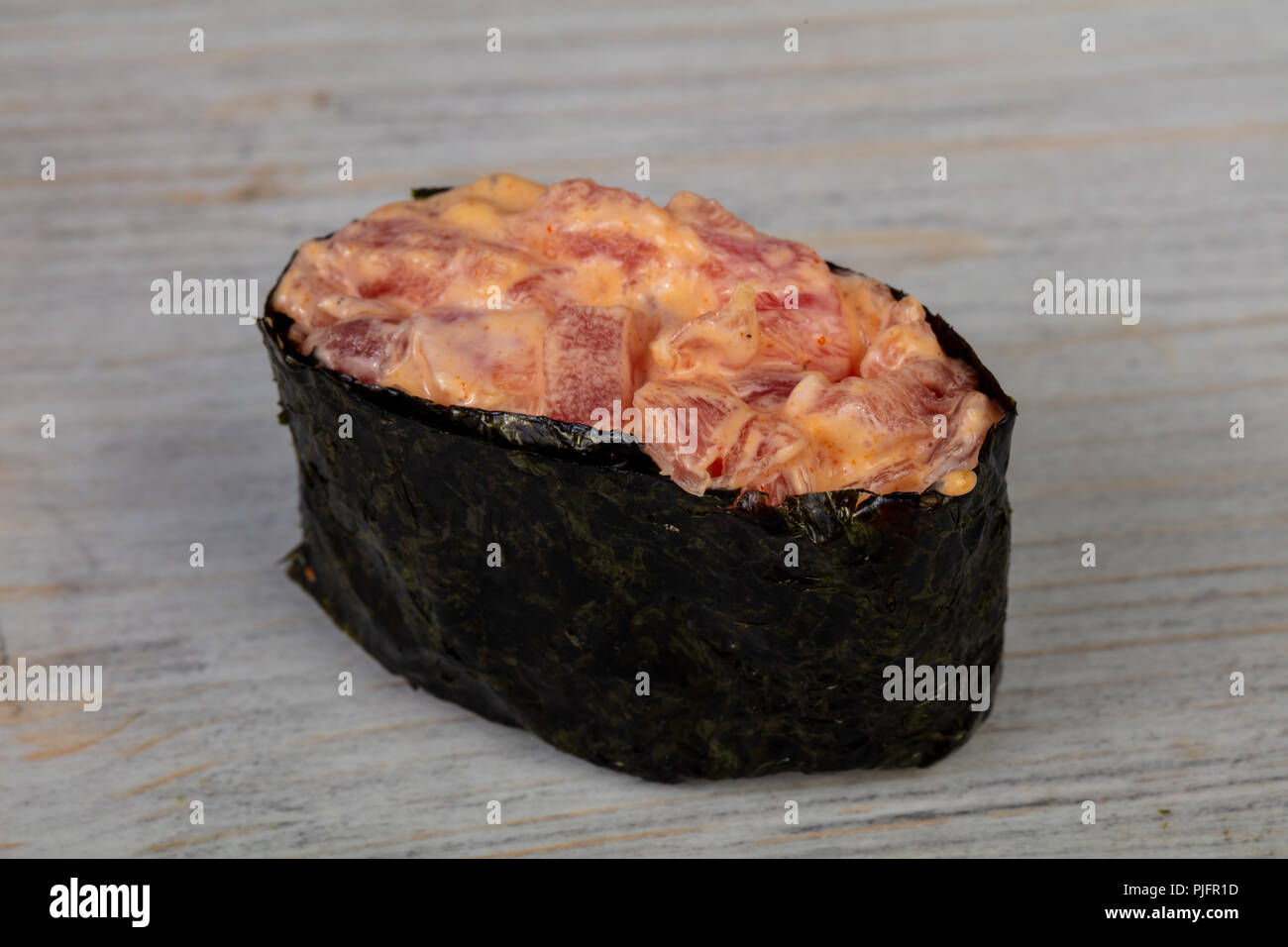 Japanese traditional Spicy gunkan sushi Stock Photo - Alamy