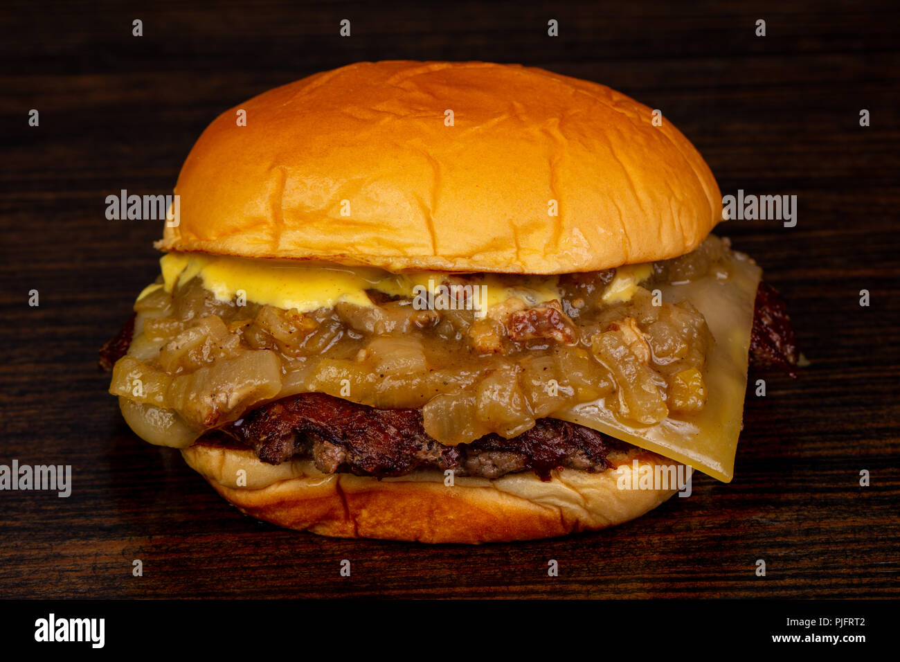 Tasty hot burger over wooden background Stock Photo - Alamy