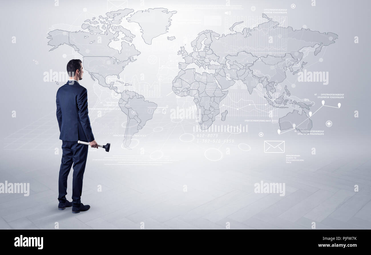 Businessman standing with his back and looking at a worldwide map with ...