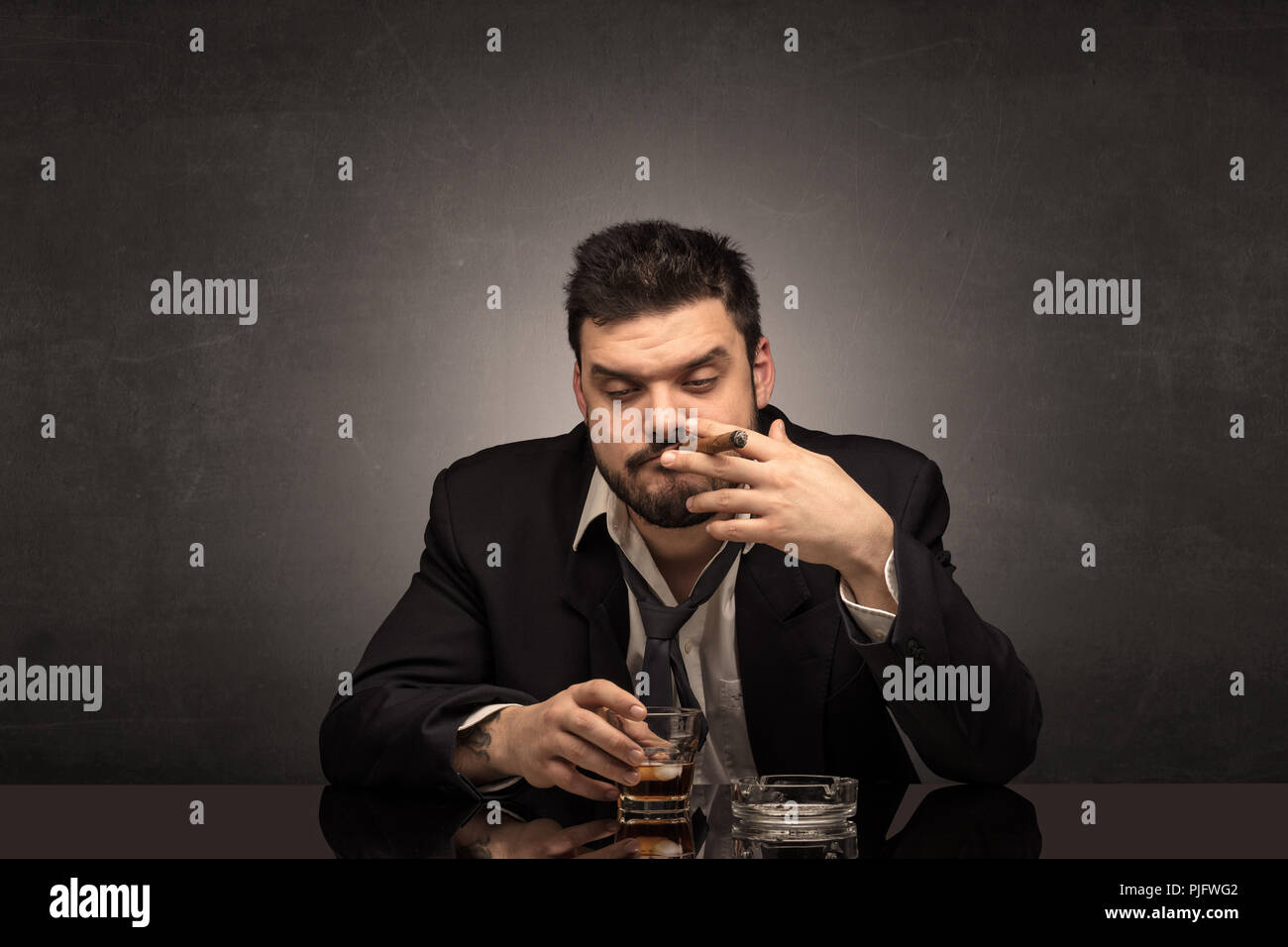 Young drunk man at his office with free dark copyspace Stock Photo - Alamy