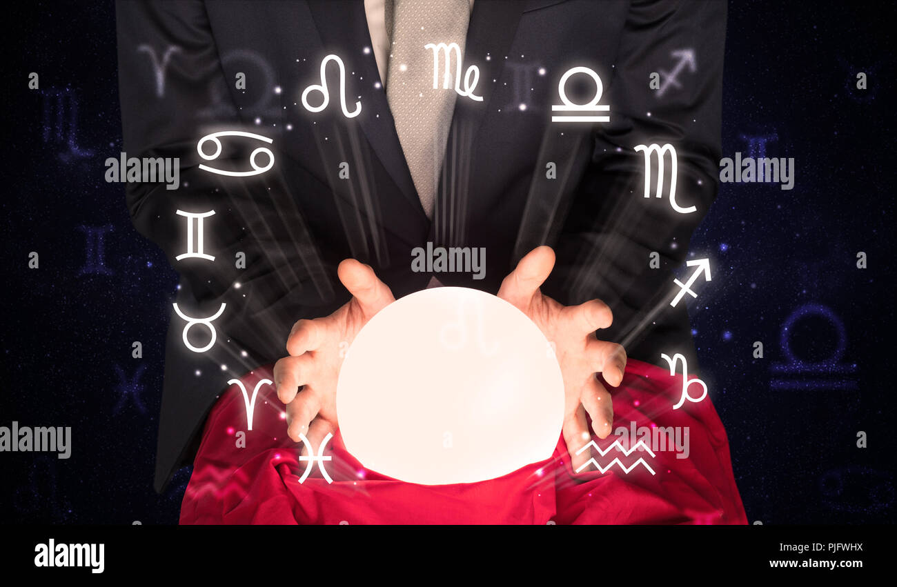 Young handsome astronaut looking for inspiration in his crystal magic ...